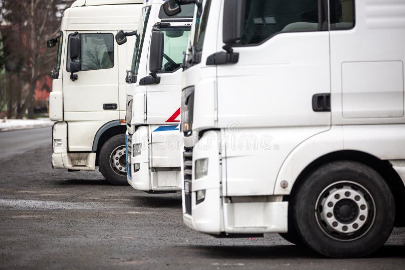 White Trucks Waiting in a Row for Loading Some Material, Logistics ...