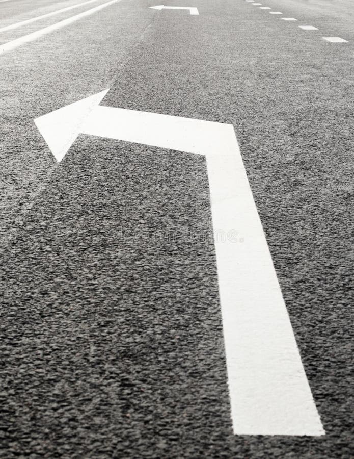 White Turn Left Arrow on the Road Stock Photo - Image of material ...