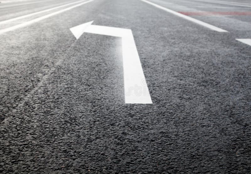 White Turn Left Arrow on the Road Stock Image - Image of arrow, change ...