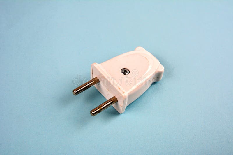 White Two Pronged Plug on a Blue Background Stock Photo - Image of ...