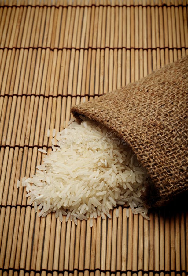 White Uncooked Rice In Small Sack Stock Photo - Image of harvesting ...