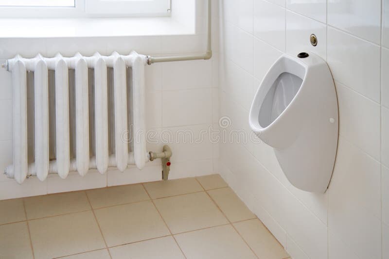 White Urinal on the Wall with Tiles. Stock Photo - Image of bathroom ...