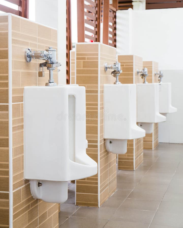 Urinals on a Tile Wall in a Restroom Stock Image - Image of toilet ...
