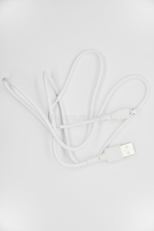 White USB Cable for Charging the Phone on a White Background. White ...