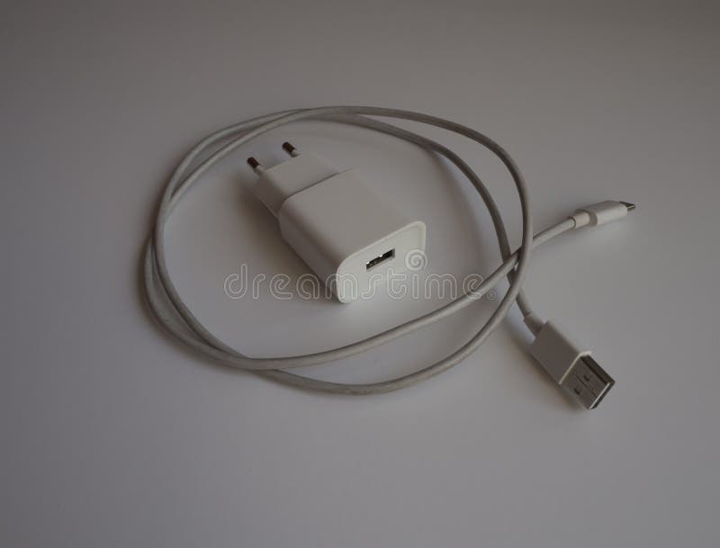 A White USB Charger for Charging a Smartphone Stock Photo - Image of ...