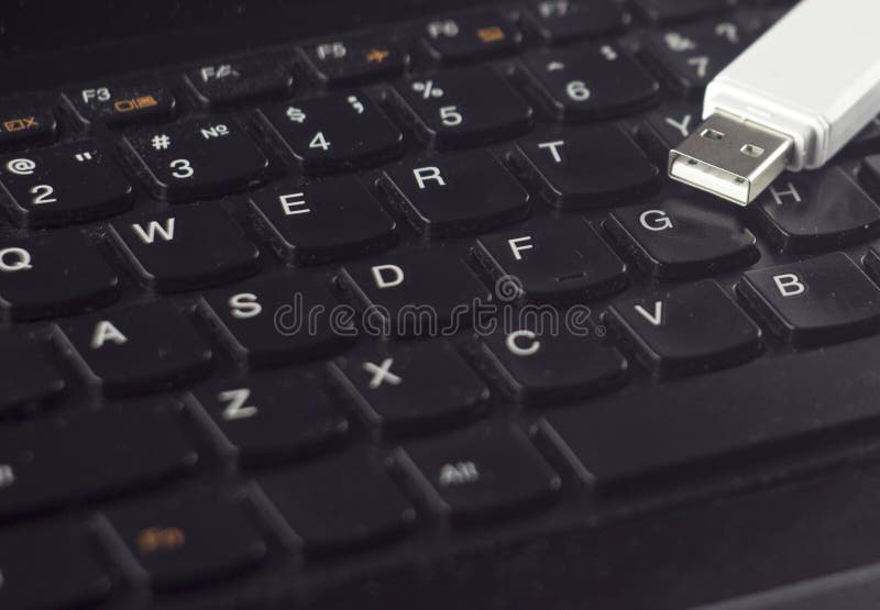 White USB Flash Drive on a Black Keyboard Usb Stock Image - Image of ...