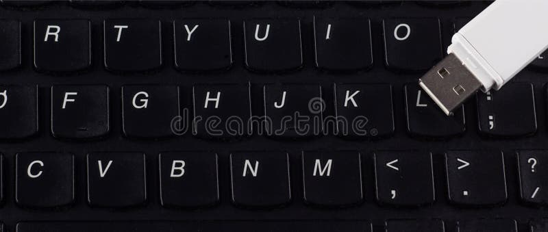 White USB Flash Drive on a Black Keyboard, Close-up Stock Photo - Image ...