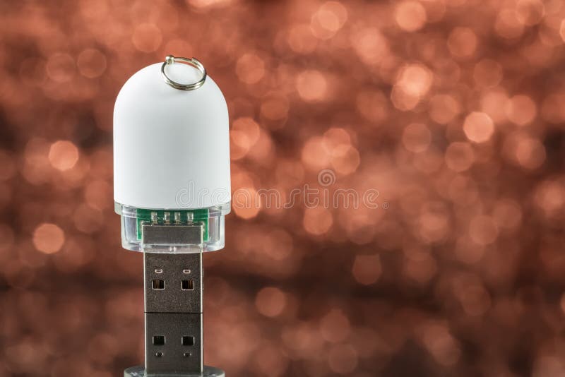 White USB Flash Drive with Brown Background Out of Focus Stock Photo ...