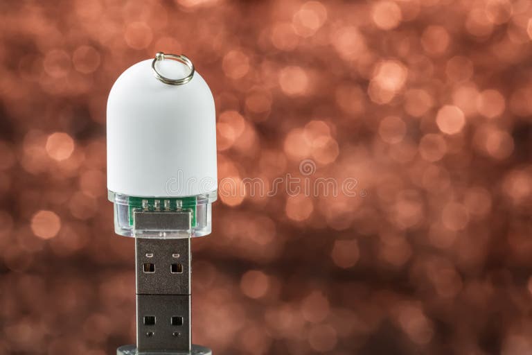 White USB Flash Drive with Brown Background Out of Focus Stock Photo ...