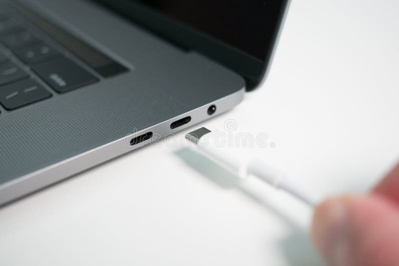 A White USB Type C / USB-C Cable Being Plugged into a Modern Notebook ...