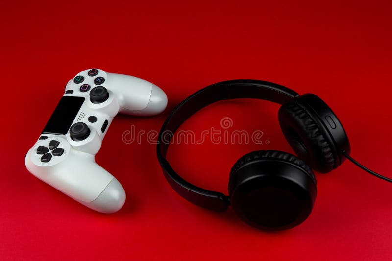Video Games Controller and Headphones on a Red Table Top Stock Photo ...