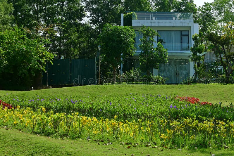 White Villa and Flower Garden at the Front Stock Photo - Image of ...