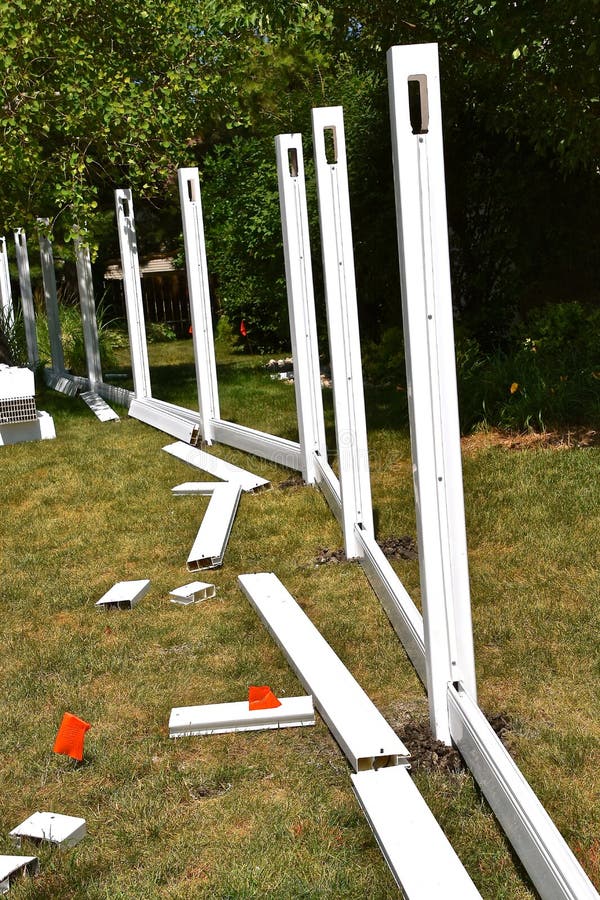 White Vinyl Posts and Railing As Part of a Backyard Privacy Fence Stock ...