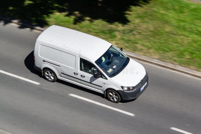 Old White Volkswagen T1 Pickup Van with a Man Sleeping Behind Editorial ...