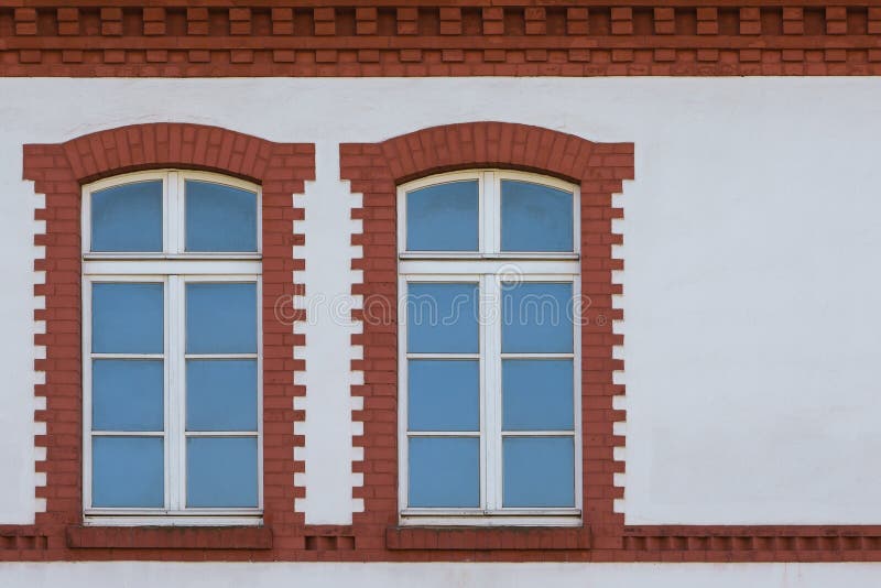 White Wall of the Building with Two Windows on the Left Side. the ...