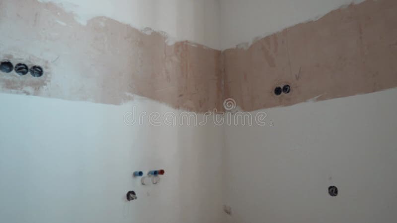 White Wall with Circular Electrical Outlets Junction Boxes in the Wall ...