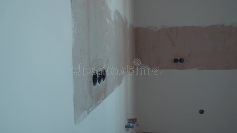 White Wall with Circular Electrical Outlets Junction Boxes in the Wall ...