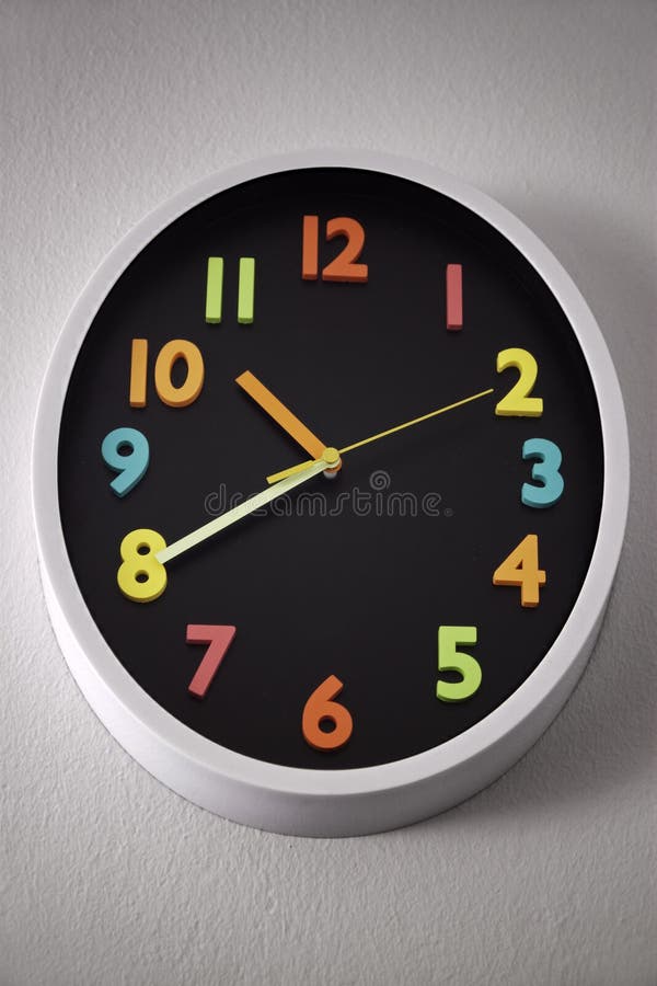 White Wall Clock in the Form of a Ellipse Stock Photo - Image of empty ...