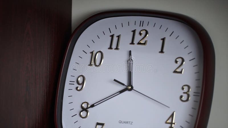 White Wall Clock. Oval Wall Clock Shows 11:40. Time Stock Photo - Image ...