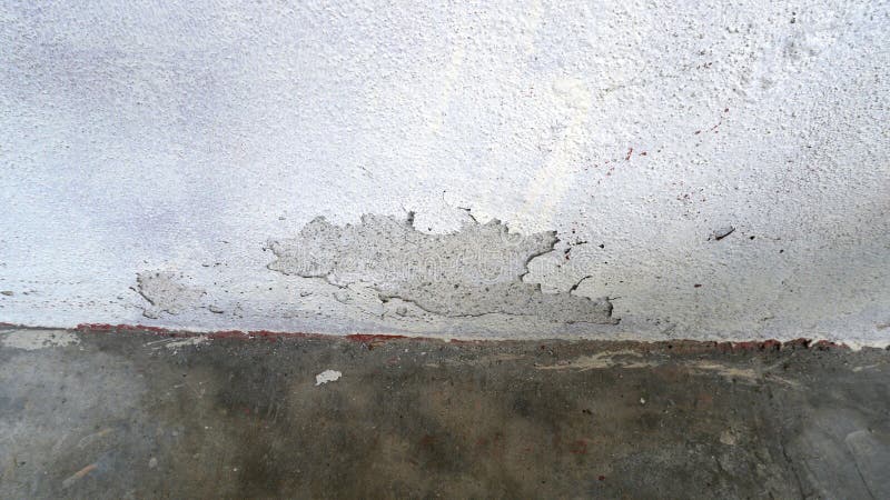White Wall with a Long Crack or Rip and a Piece of Plaster Missing ...