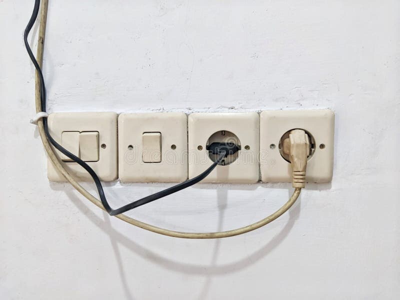 White Wall Power Sockets with Plugged Cables Stock Image - Image of ...