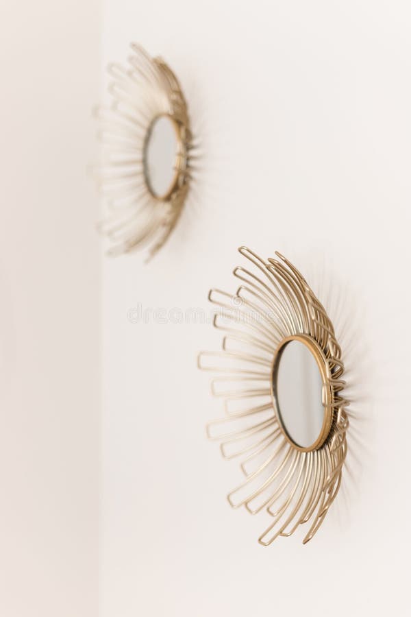 White Wall with Two Beautiful Round Gold Sun Mirrors Stock Photo ...