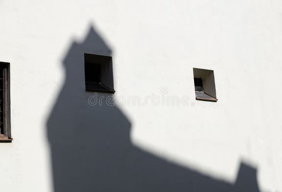 A White Wall with Windows and on the Wall an Unusual Shadow from the ...