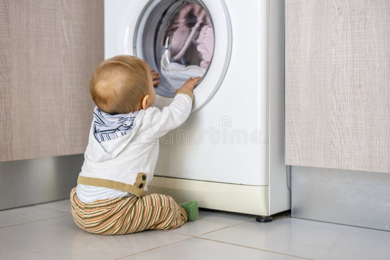White Washing Machine Keeps Busy the Little Baby Boy Stock Image ...