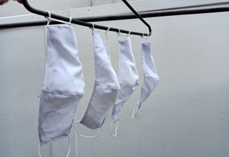 White Washing Mask Airing and Hanging on the Iron Stock Photo - Image ...
