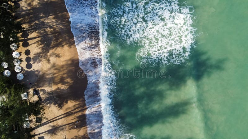 White Wave of Blue Sea with Tree Shadows, Top View from Drone ...