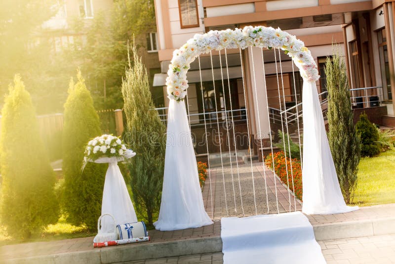 White wedding arch stock photo. Image of flowers, beauty - 67730964