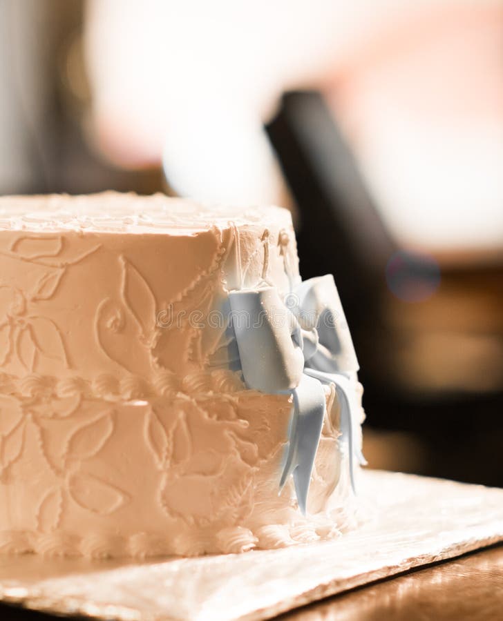 White Wedding Cake with a Large Blue Bow Stock Photo - Image of ...