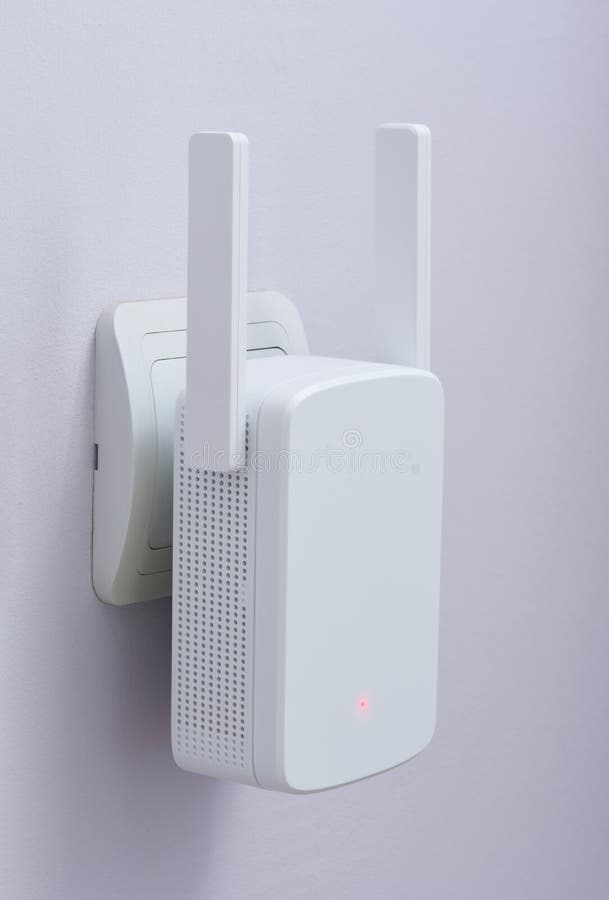 White Wi-fi Range Extender Plugged in Electrical Socket Stock Photo ...