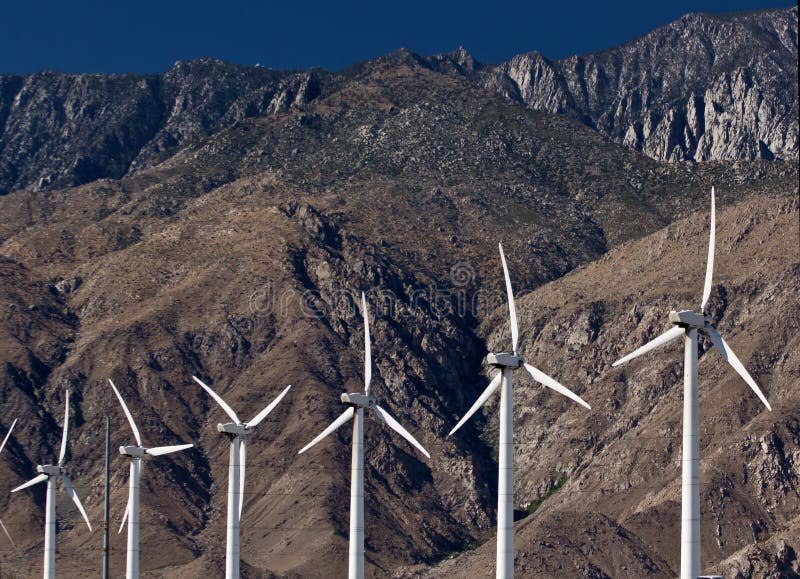 White Wind Turbines Against Colorful Mountain Back Stock Image - Image ...