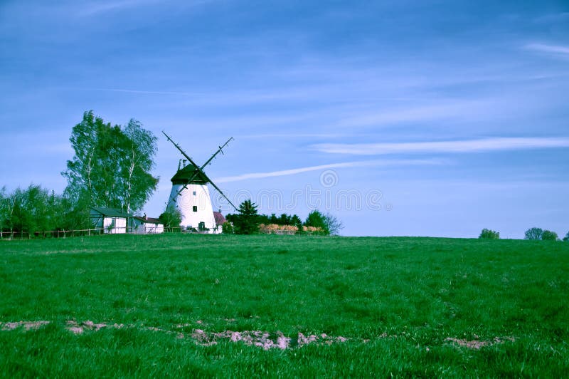 White Windmill on Green Farm Field Stock Image - Image of windmill ...