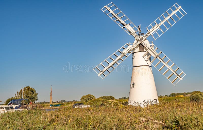 Traditional White Windmill Nestled in the Rural Countryside Stock Photo ...