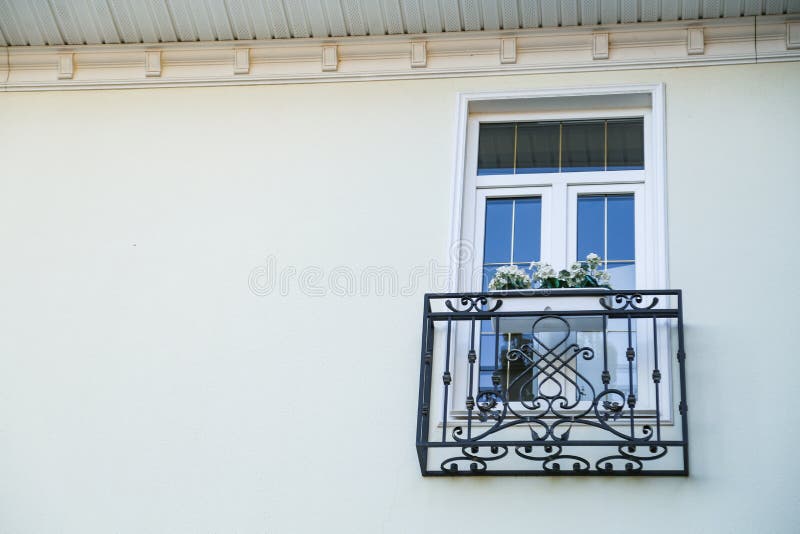White Window with Black Wrought Iron Sill Stock Image - Image of ...