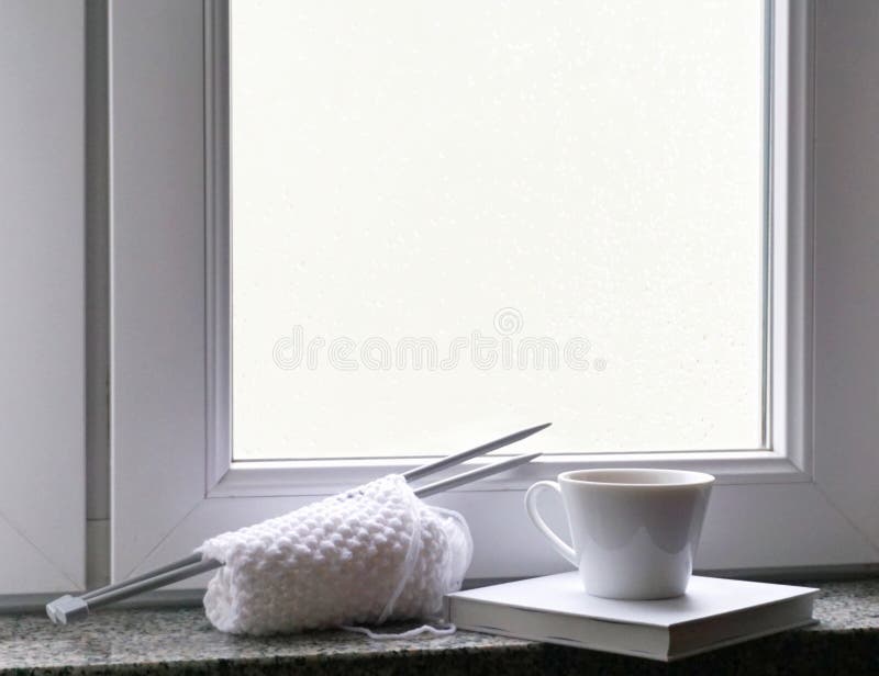 White Window Frame with Rain Drops on it and Stuff for Relaxing in ...
