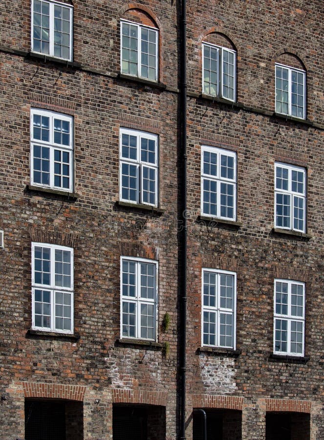 White Window Frames in Brown Brick Walls Stock Photo - Image of frames ...