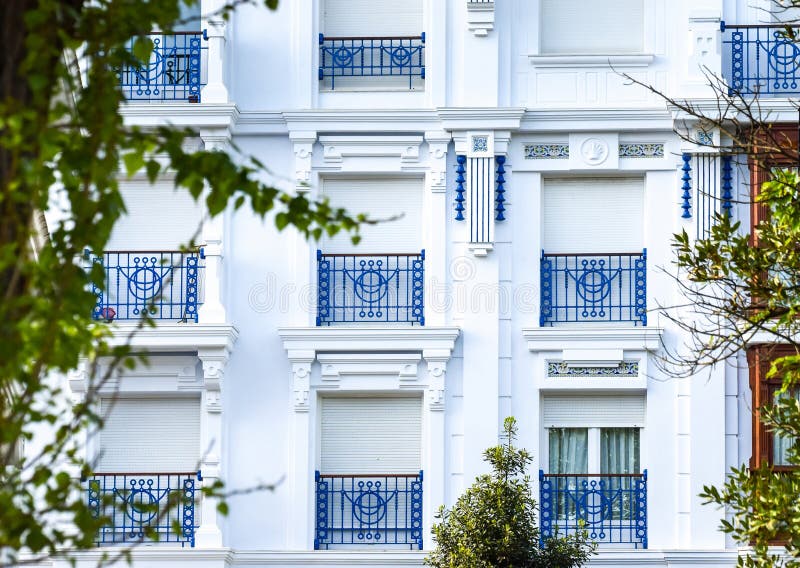 White Windows, Blue Railings Stock Photo - Image of blue, detail: 54409750