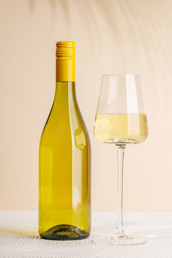 White Wine Bottle and Wine Glass Stock Photo - Image of leaves, bottles ...