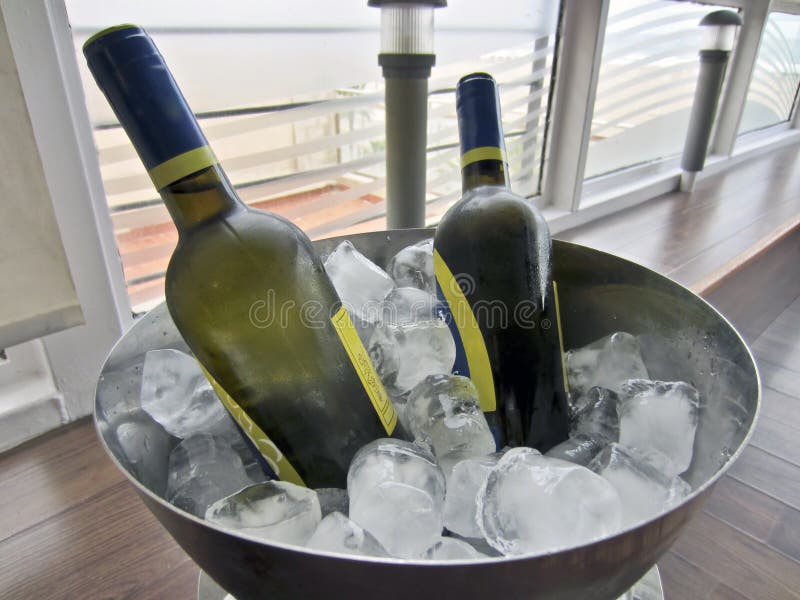 White wine bottles in ice stock image. Image of wine - 40973887