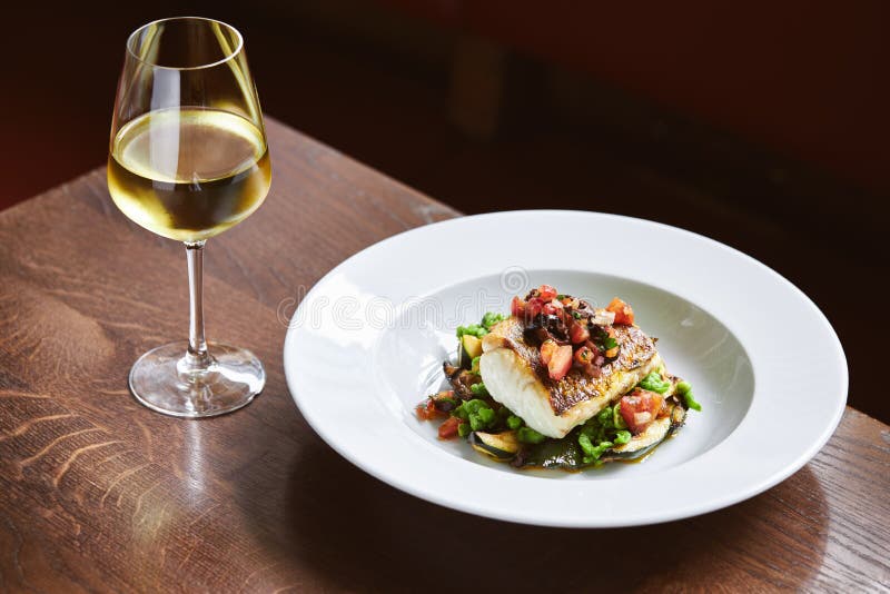 White Wine and Cod Dish in Restaurant Stock Photo - Image of life ...
