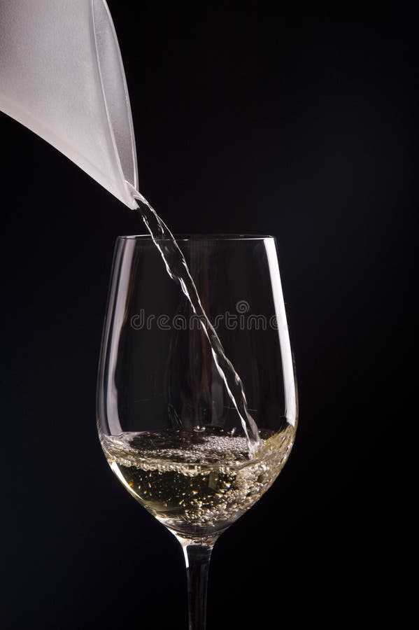 White Wine Being Poured stock photo. Image of wine, isolated - 10150382