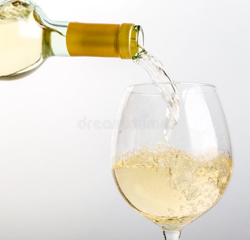 White Wine Pouring in Glass from a Bottle Stock Image - Image of ...