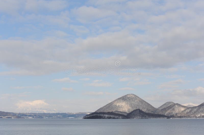 White Winter Landscape with a Snow-covered Volcano Stock Photo - Image ...