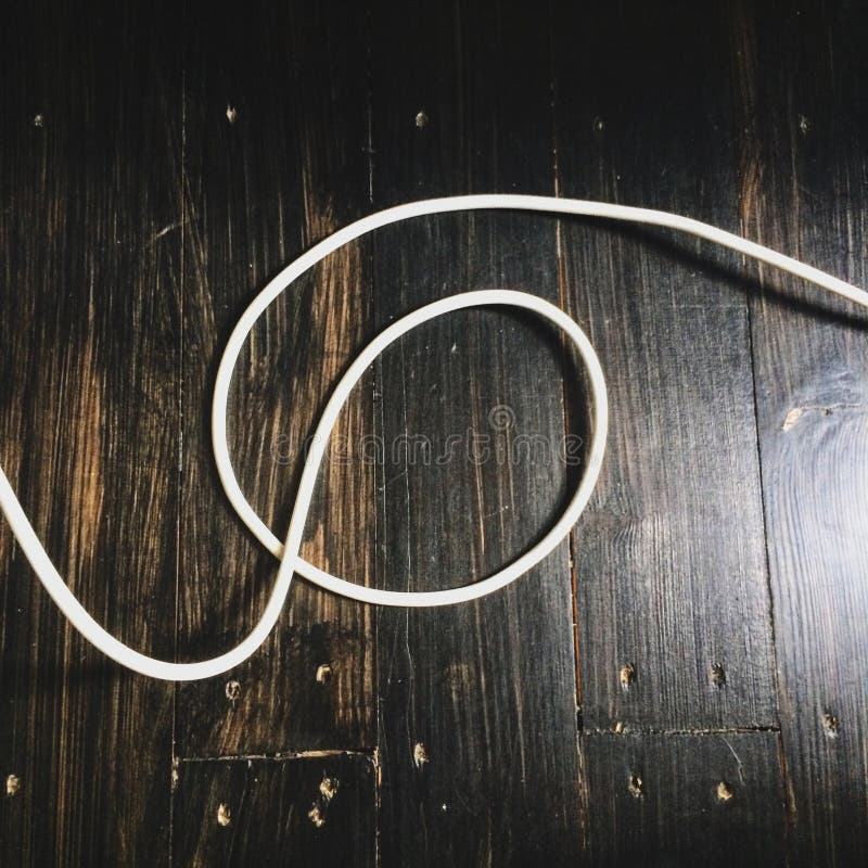 White wire on wooden stock image. Image of cord, electric - 113601223