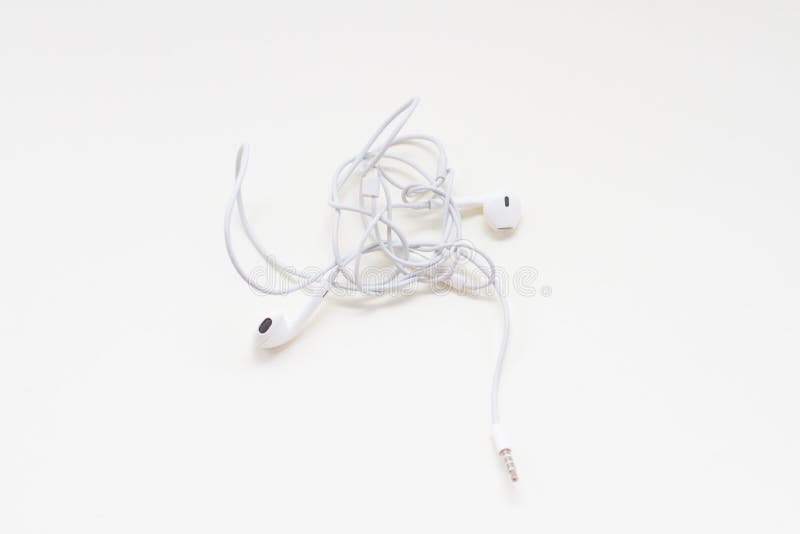 A White Wired Earbuds with Tangled Wires Stock Image - Image of ...