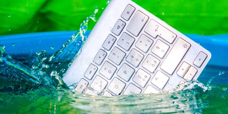 White Wireless Computer Keyboard Falling into the Water Spraying Stock ...