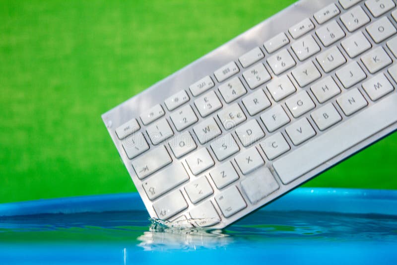 White Wireless Computer Keyboard Falling into the Water Spraying Stock ...